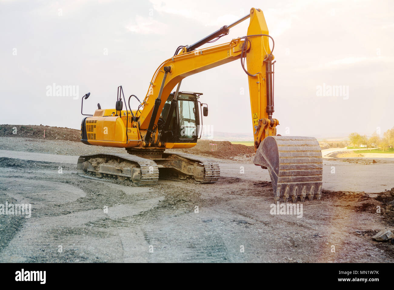 excavator at a street construction site on the countryside Stock Photo ...