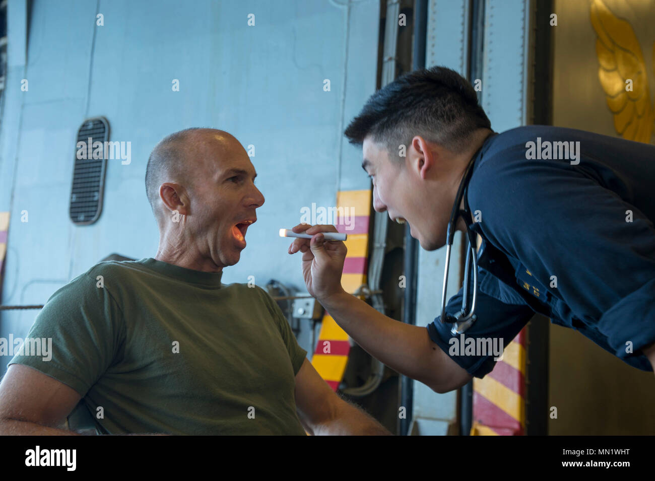 170812-N-RU971-010 CORAL SEA (Aug. 12, 2017) Lt. Daniel Kim (right ...