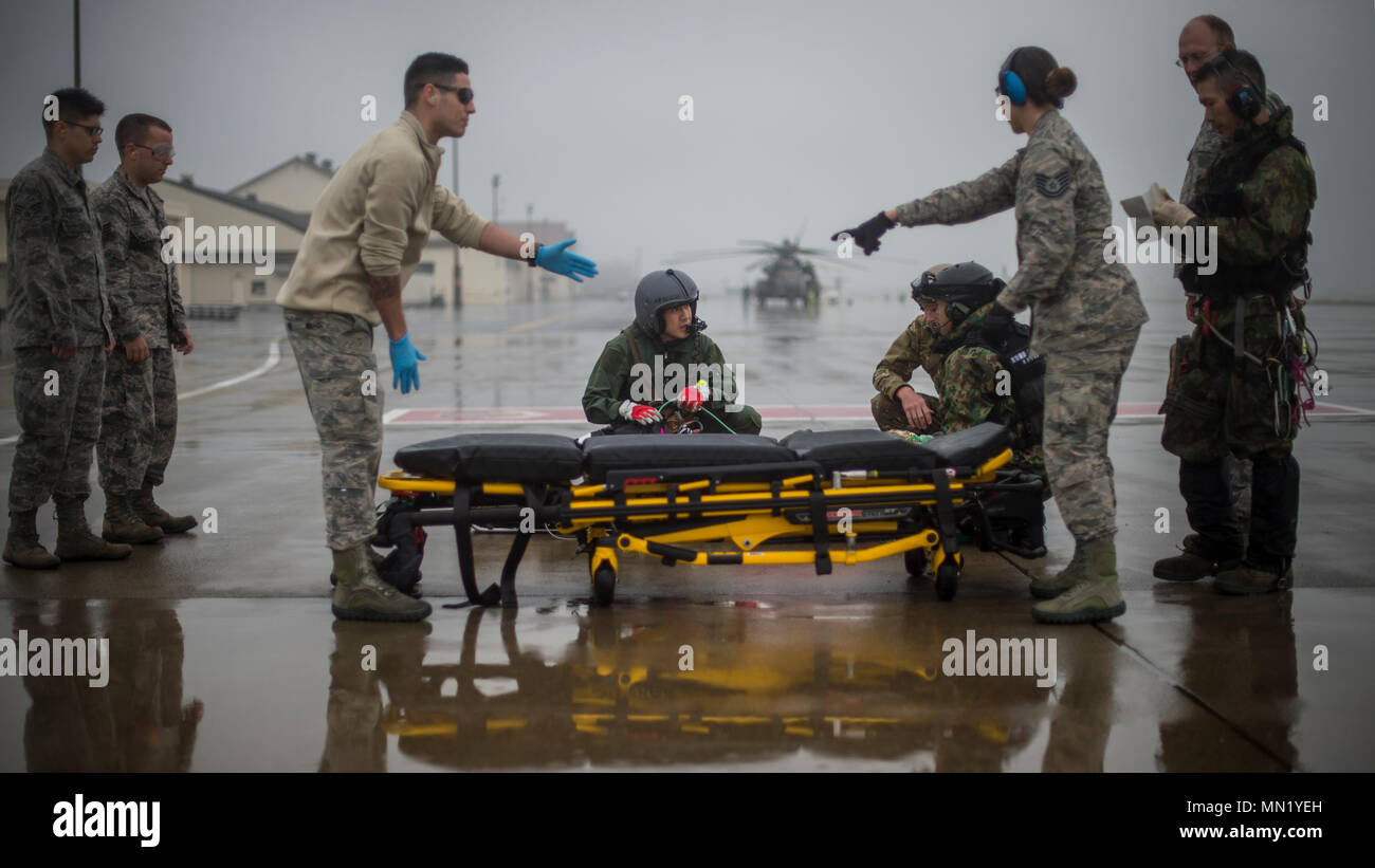 Personnel from the 35th Medical Group and 35th Operations Group work ...
