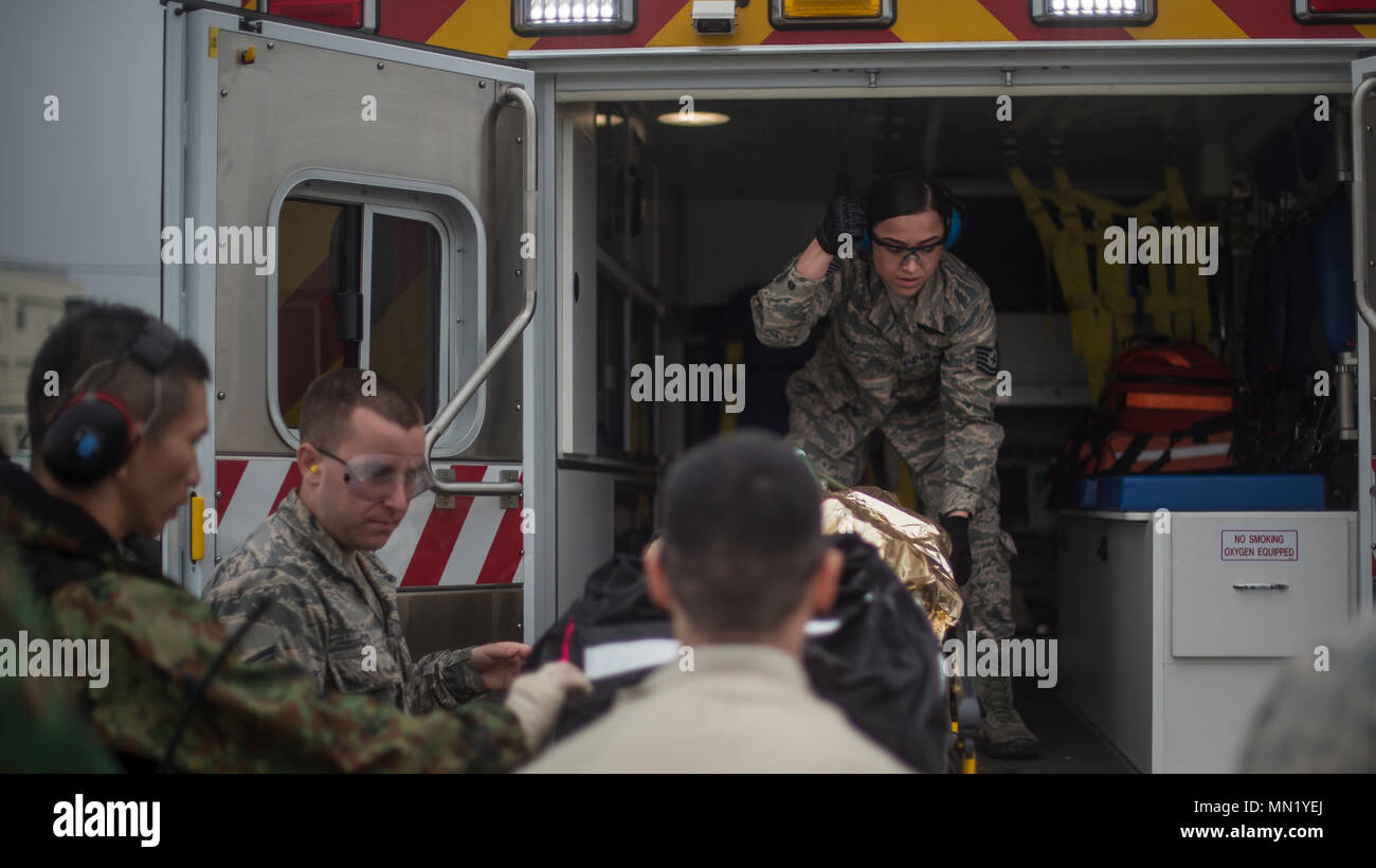 Personnel from the 35th Medical Group and 35th Operations Group work ...