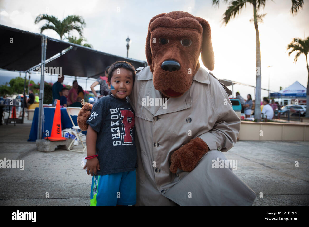 Phoenix Lee, 5, poses for a photo with McGruff the Crime Dog during the ...