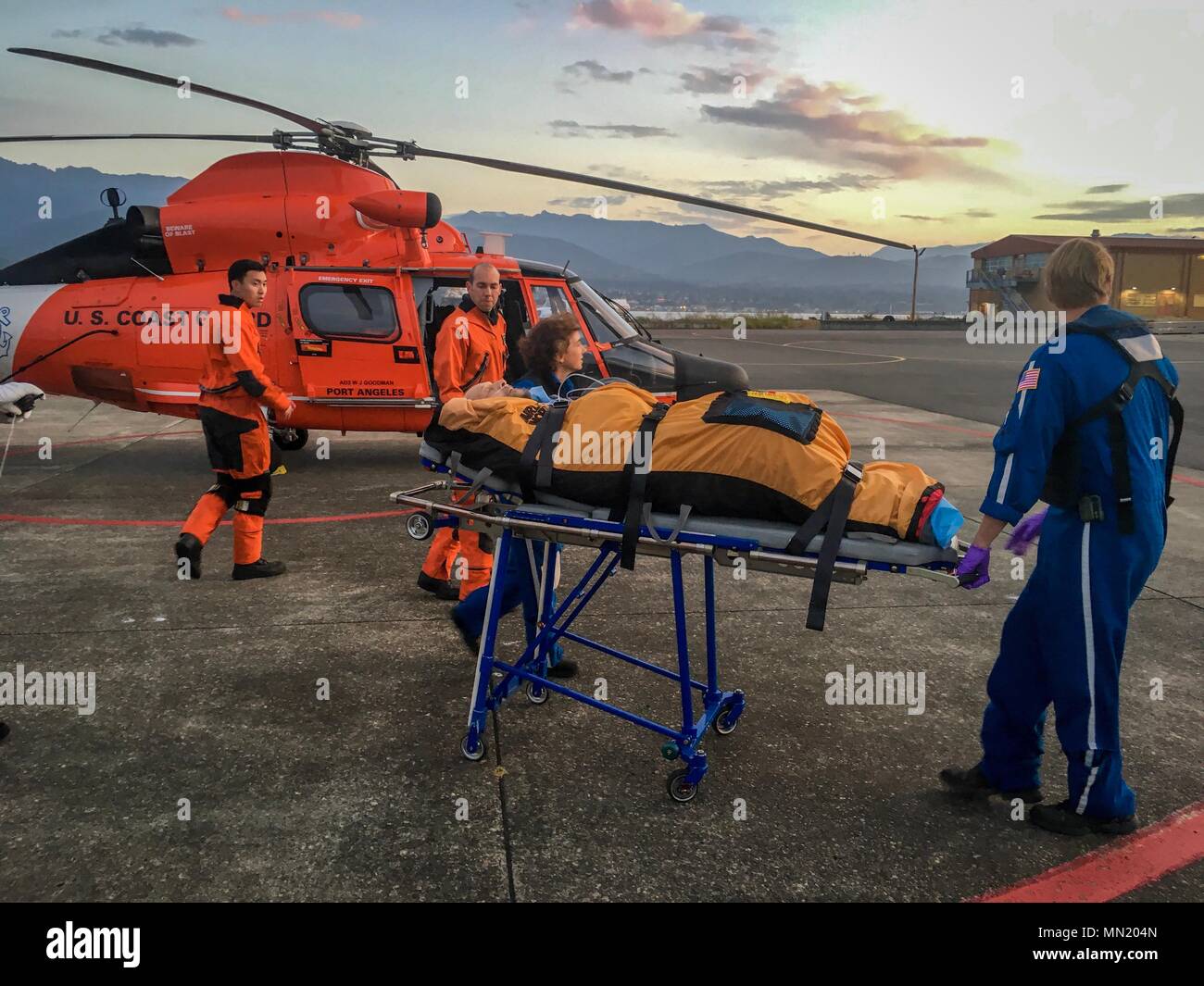 An Air Station Port Angeles aircrew transfers a medevac patient to ...