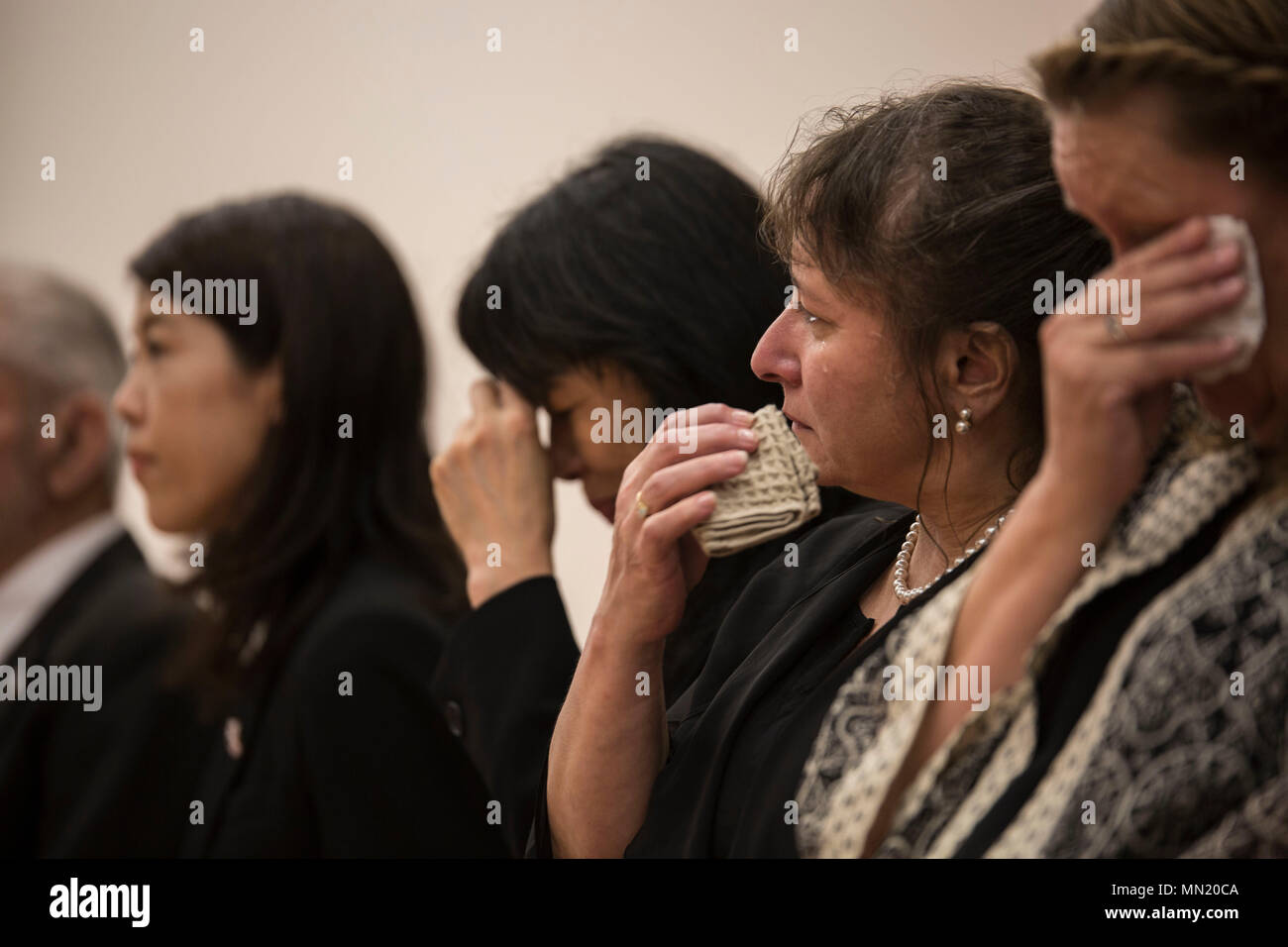 Brenda Strombo sheds a tear during a flag returning ceremony at ...