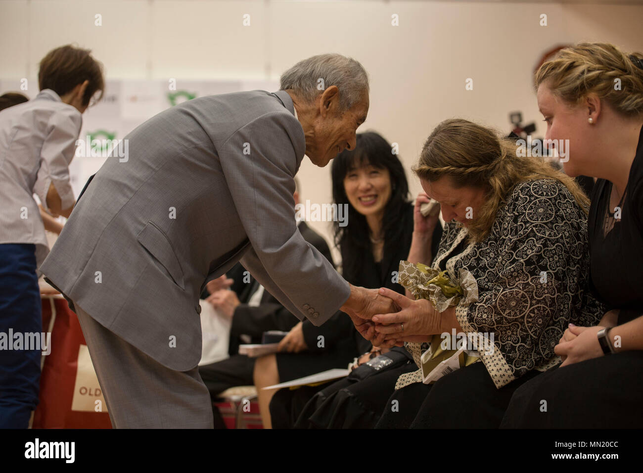Tatsuya Yasue presents a gift to World War II veteran Marvin Strombos ...