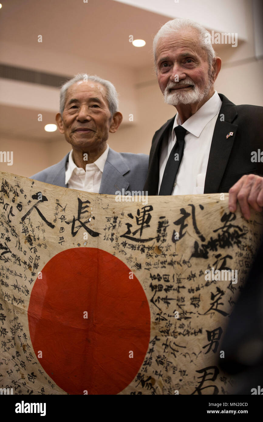Tatsuya Yasue, left, poses for a photo with World War II veteran Marvin ...