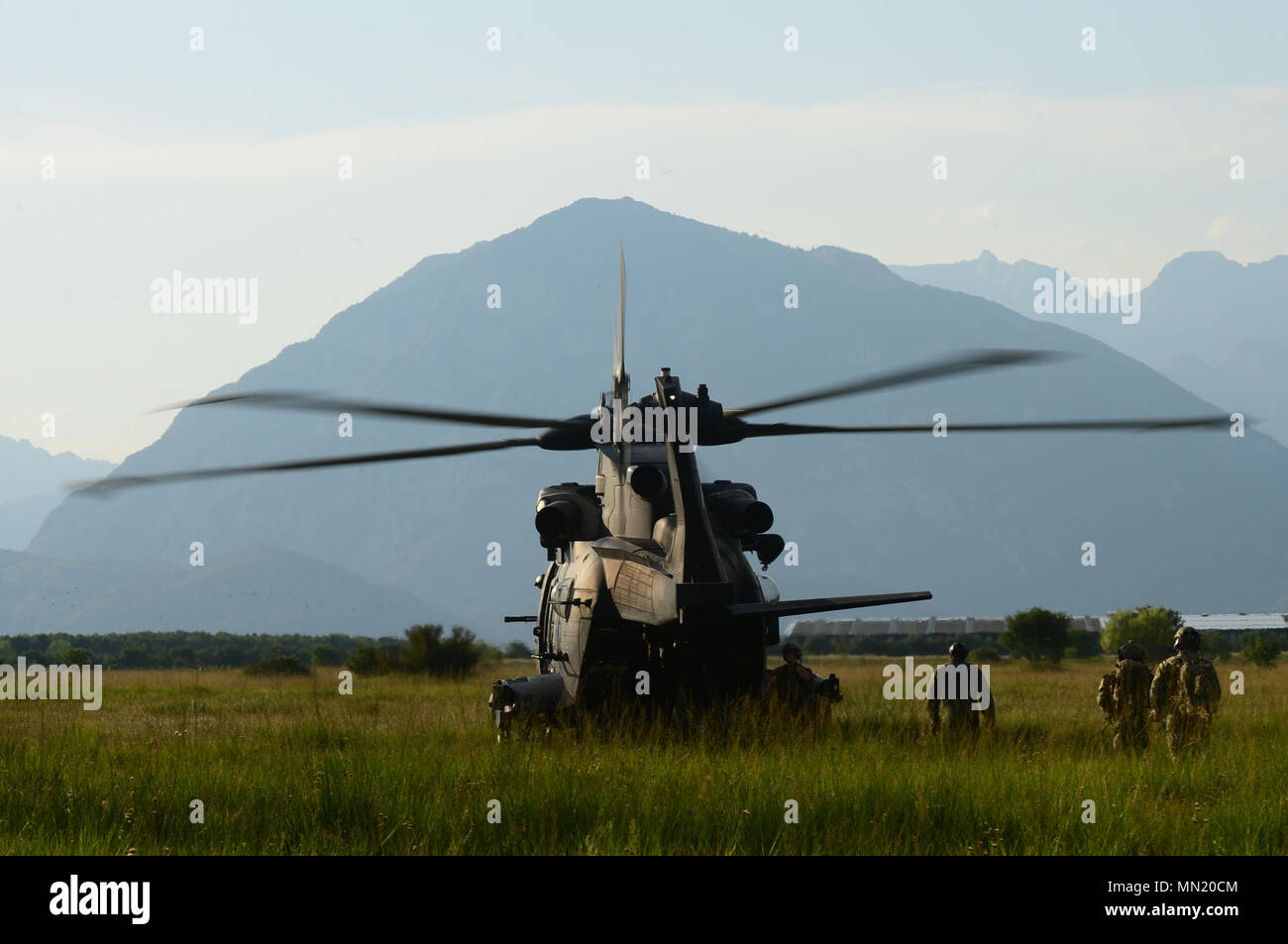 An Italian Air Force HH-101 Caesar extracts a team of Guardian Angels ...