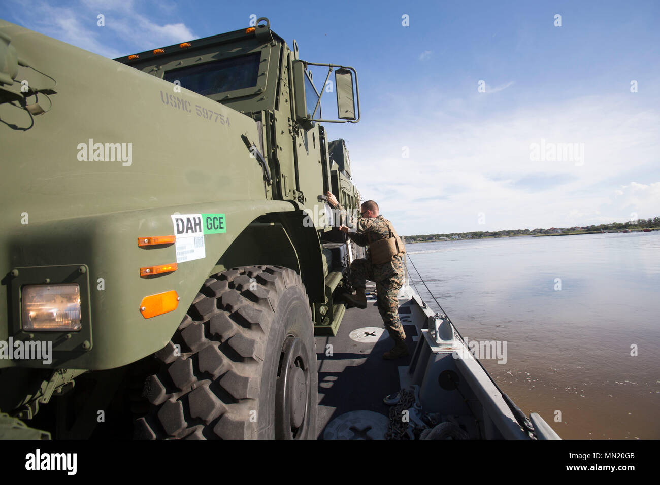 Marines prepare to drive a medium tactical vehicle replacement to a ...