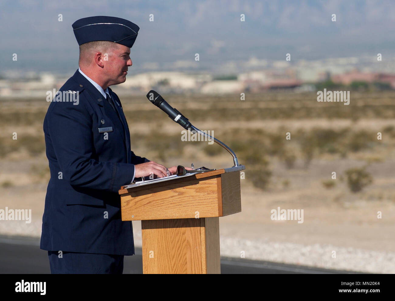 Col. Kenneth Herndon, 820th RED HORSE Squadron commander, speaks at a ...