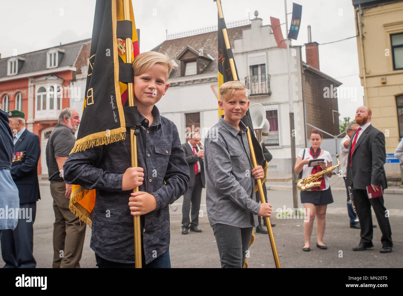 Children hold flags during a memorial ceremony for Belgian Lt. Col ...