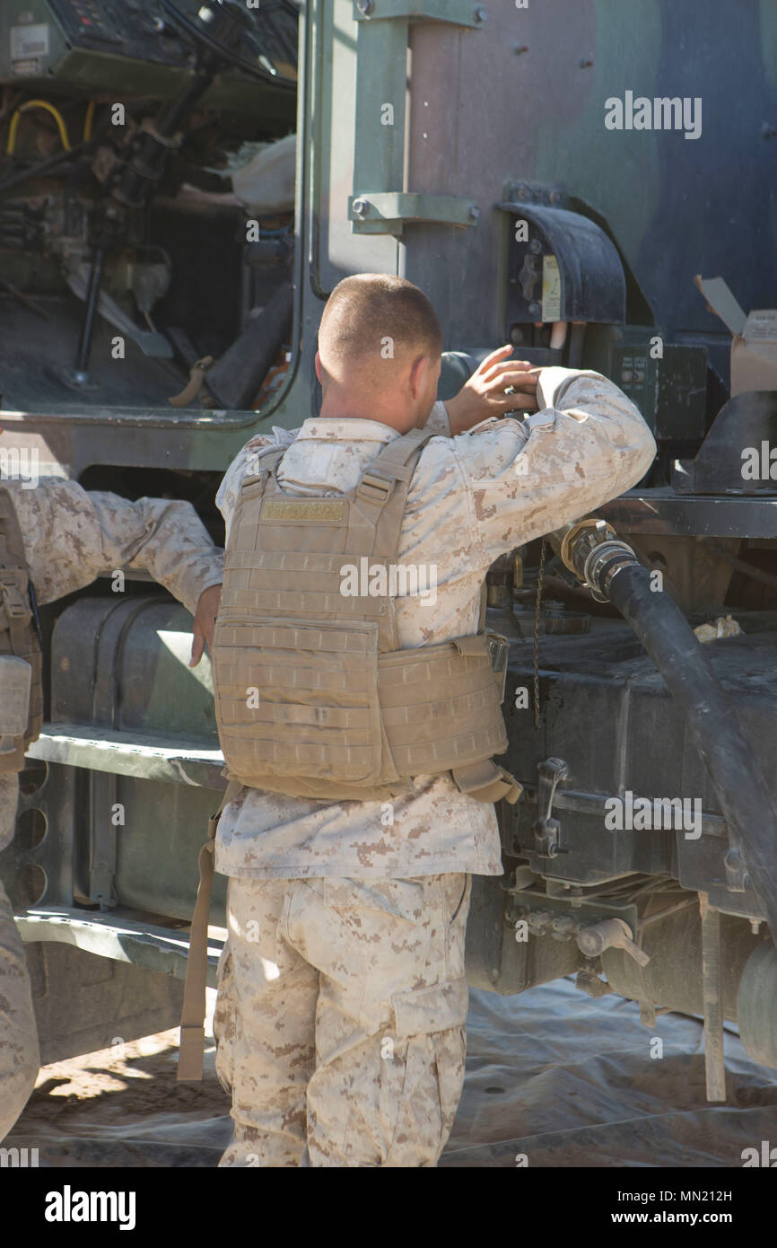 U.S. Marine with Marine Air Ground Task Force-8 (MAGTF-8) re-fuels a ...