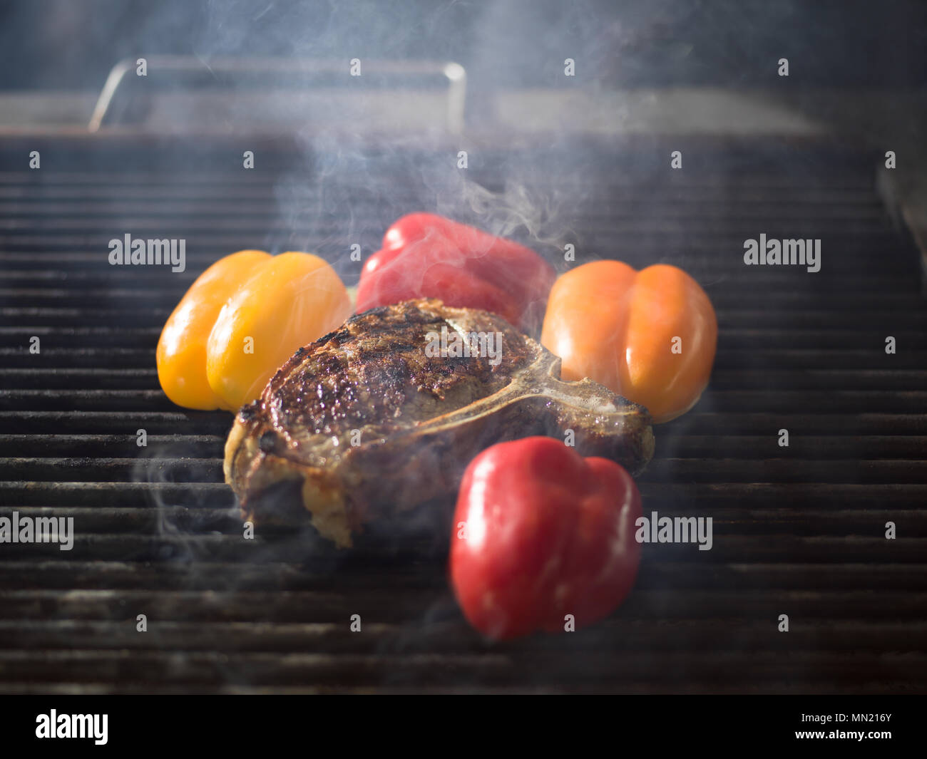 delicious grilled meat steak with vegetables on a barbecue Stock Photo ...