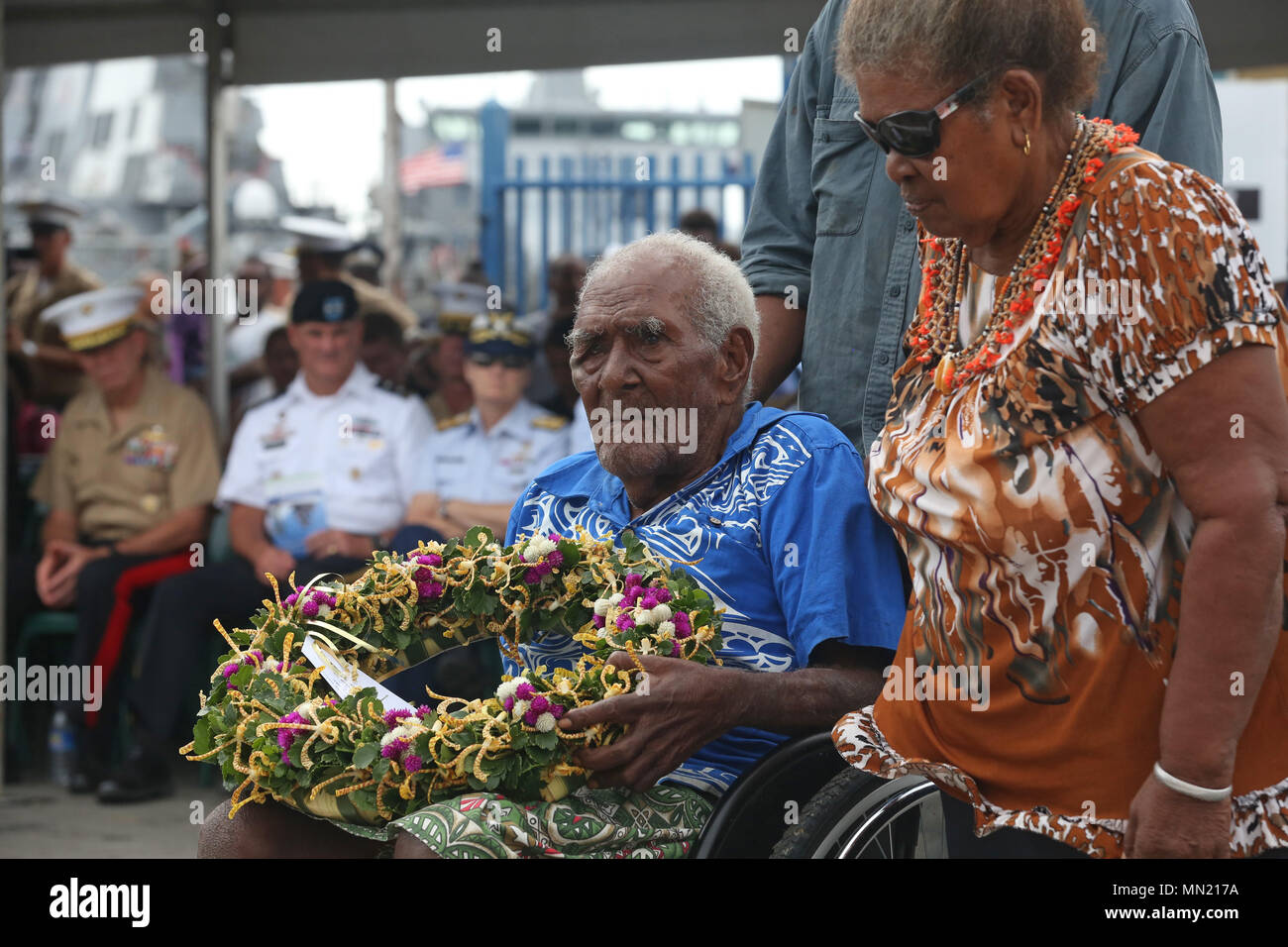 A 110-year-old Solomon Scout veteran prepares to lay a wreath during ...