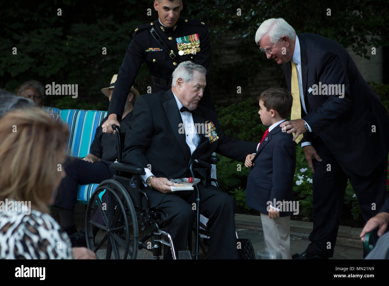 World War II veteran Col. Archie “Hap” Simpson speaks with guests ...
