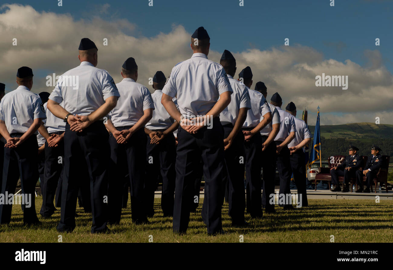 U.S. Airmen assigned the 65th Air Base Group stand in formation during ...