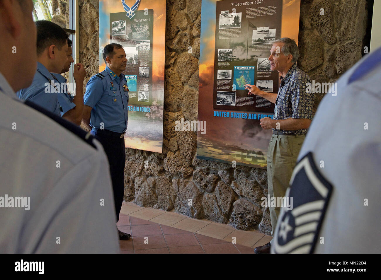 Charles Nicholls, right, Pacific Air Forces (PACAF) historian, provides ...