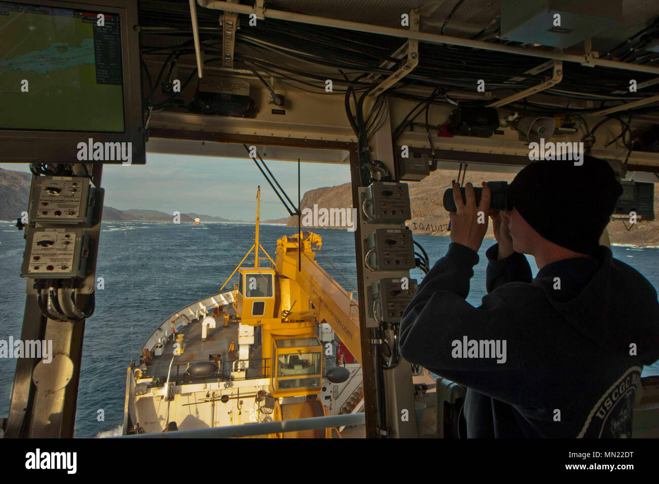 Coast Guard Cutter Maple crew member Seaman Jeffery Moore keeps lookout ...