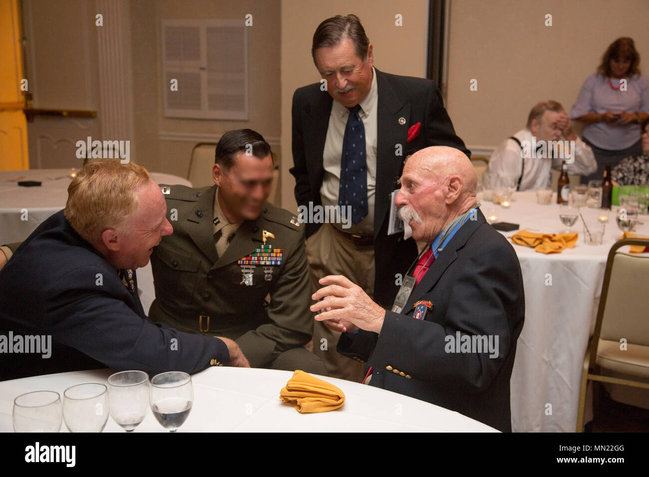 James W. Campbell, a World War II Raider, talks with a current Marine ...