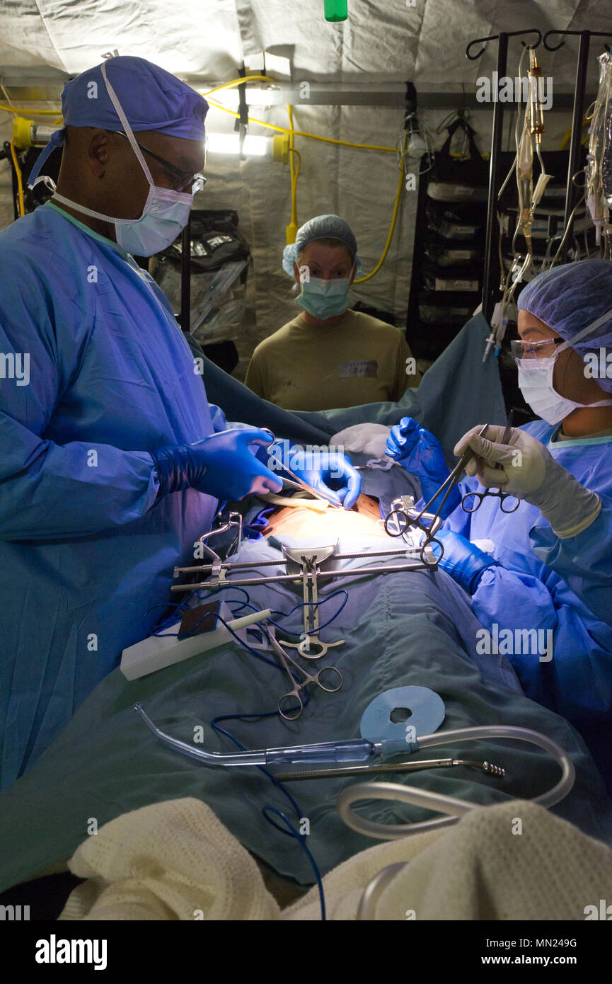 U.S. Air Force Lt. Col. Wesley Harris, left, general surgeon, and Capt ...