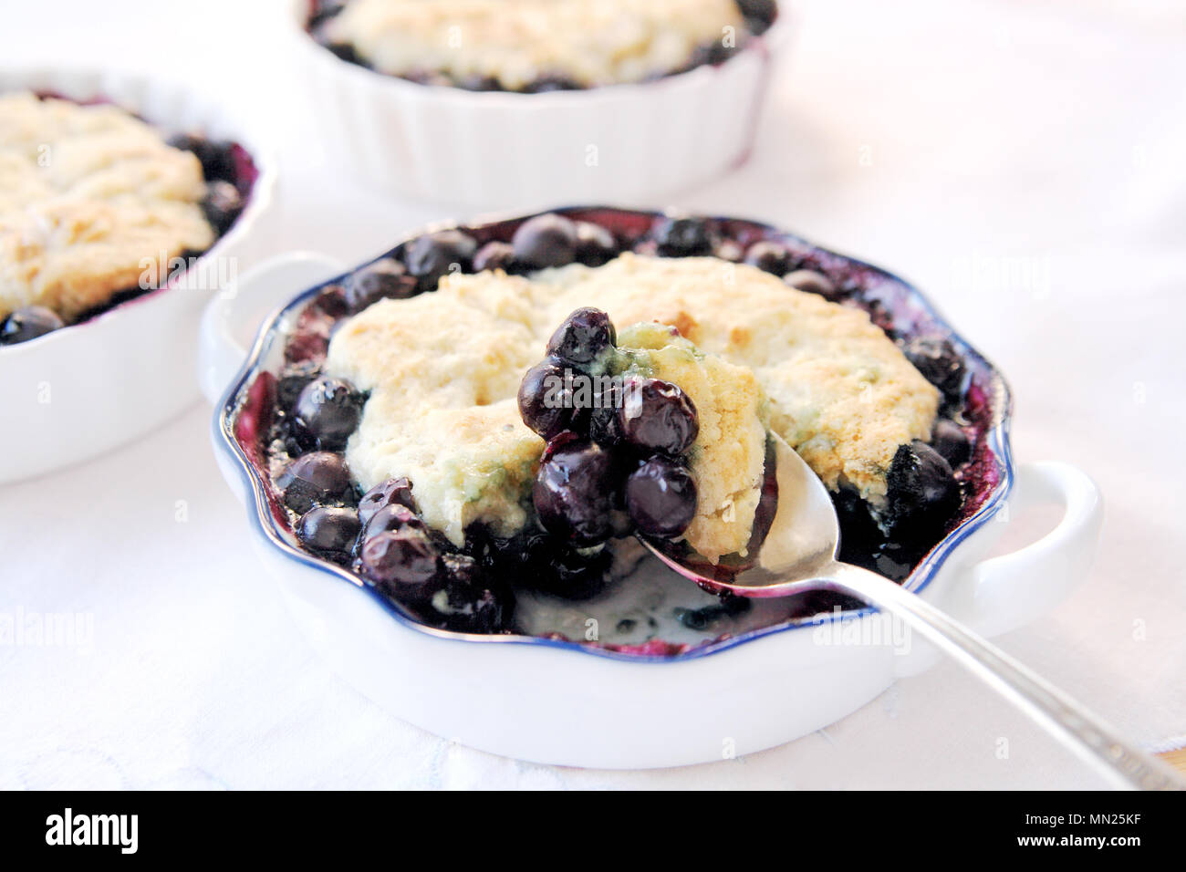 Individual servings of fresh blueberry cobbler Stock Photo - Alamy
