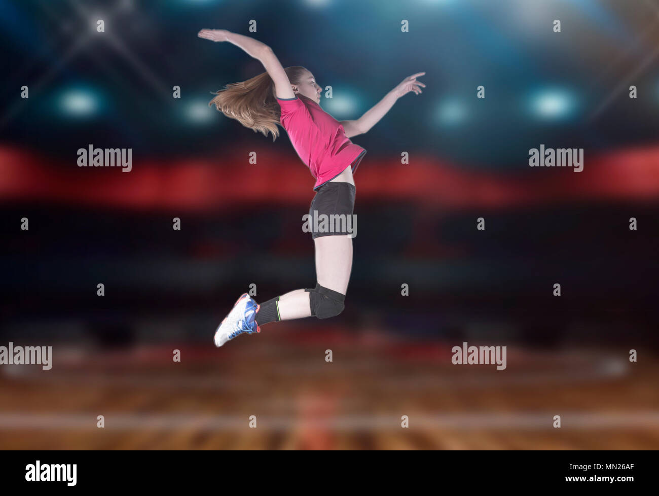 Female volleyball players jumping close-up on vollayball court Stock ...