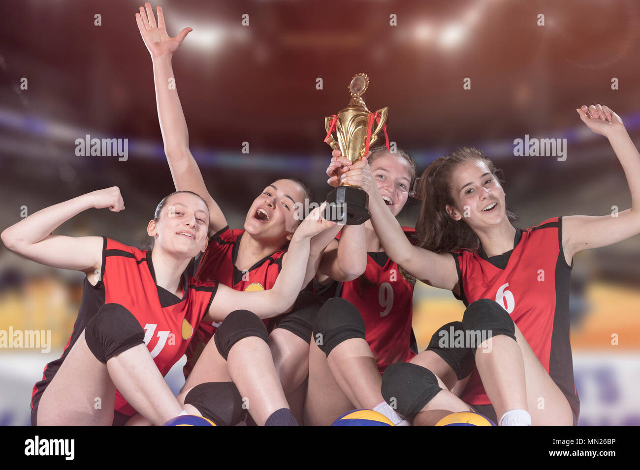 Woman volleyball Players celebrating victory and gold medal Stock Photo ...