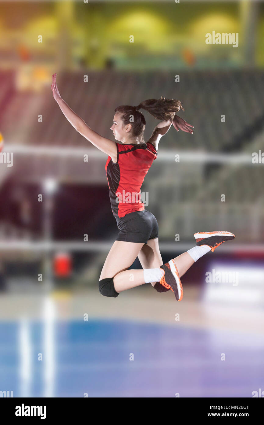 Female volleyball players jumping close-up on vollayball court Stock ...