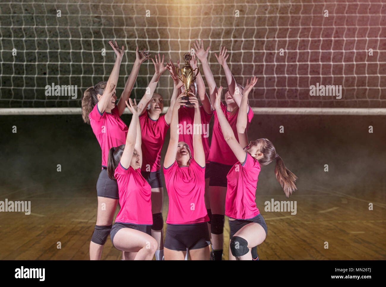 Woman volleyball Players celebrating victory and gold medal Stock Photo ...