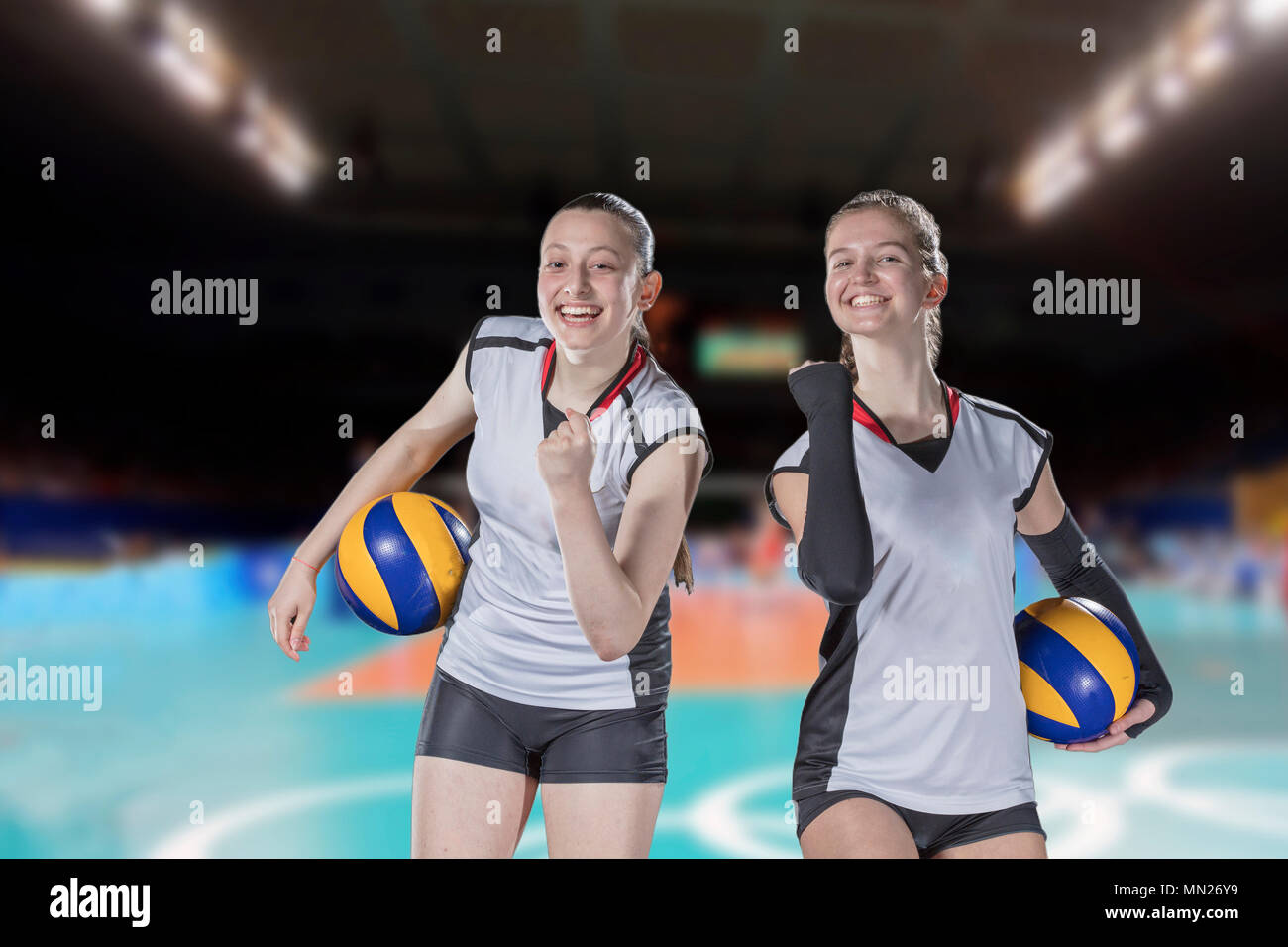 Woman volleyball Players celebrating victory and gold medal Stock Photo ...
