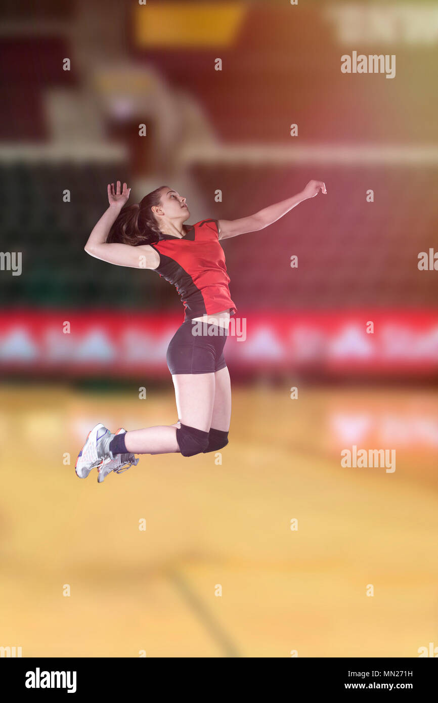 Female volleyball players jumping close-up on vollayball court Stock ...