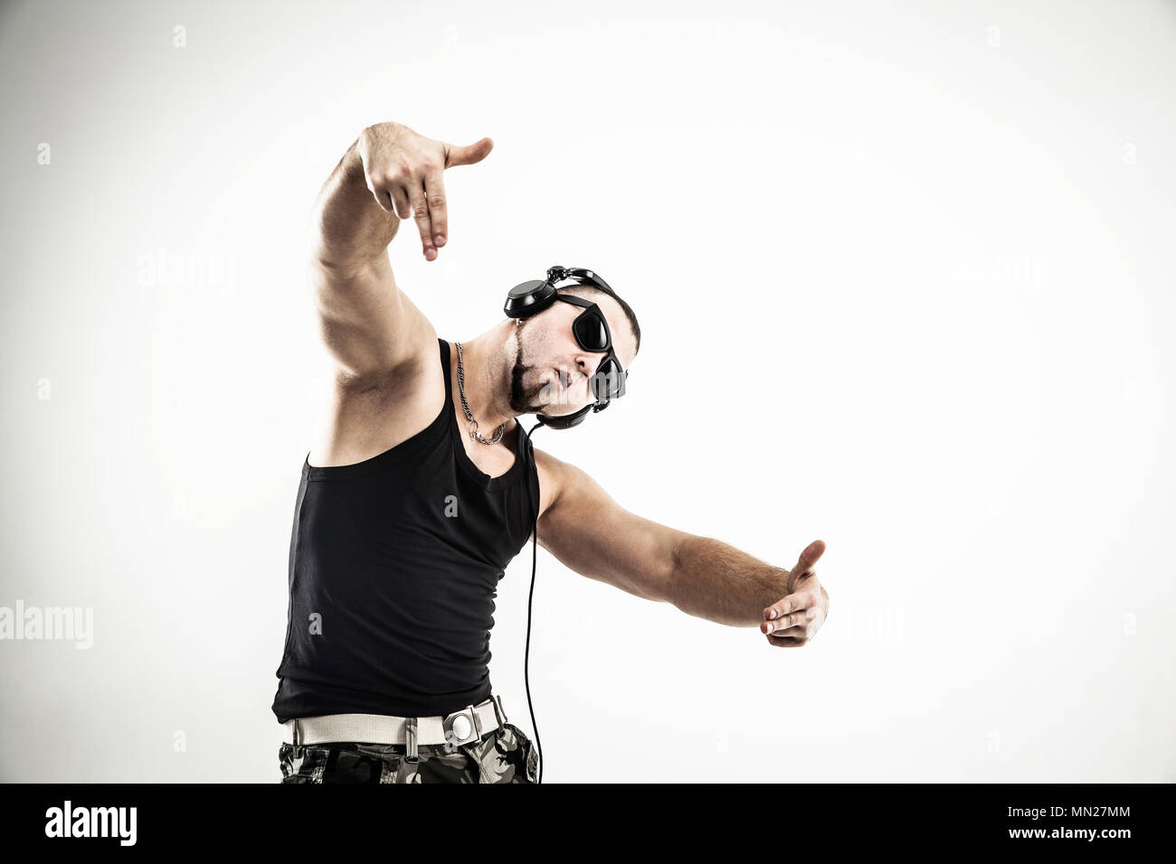 emotional and charismatic DJ - rapper in headphones takes the ra Stock ...