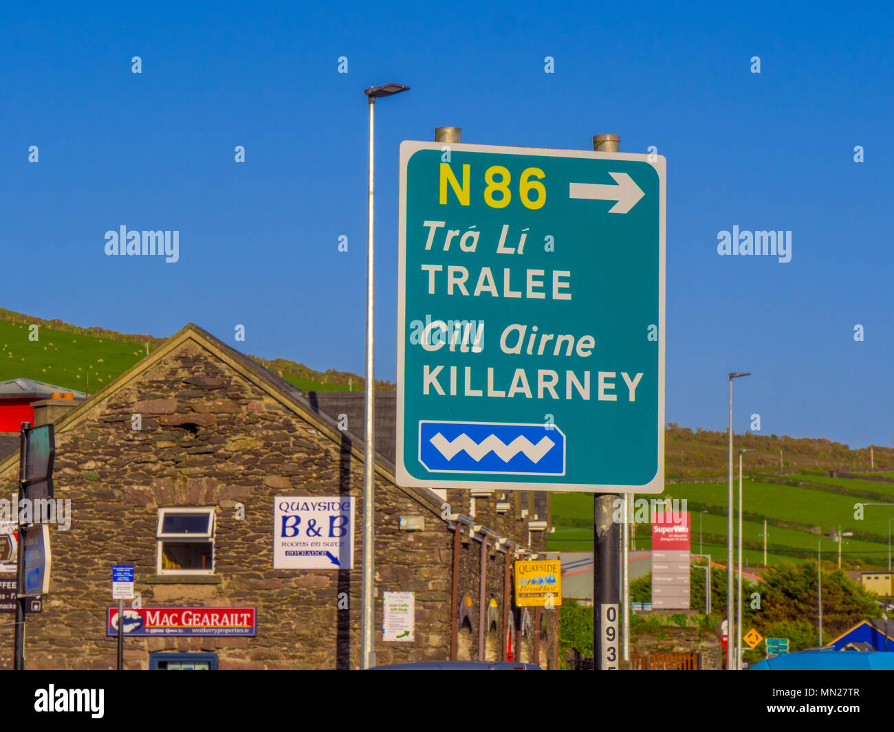 Direction sign to Killarney and Tralee Stock Photo - Alamy