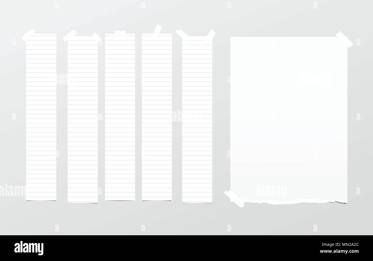 White vertical note paper pieces, torn notebook sheet for text stuck on ...