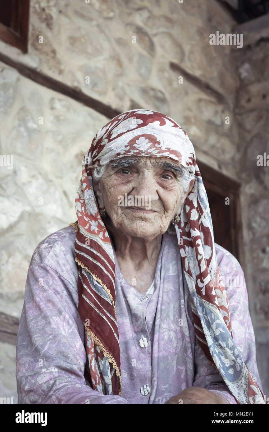 Unidentified old Turkish Muslim woman poses for camera in front of an ...