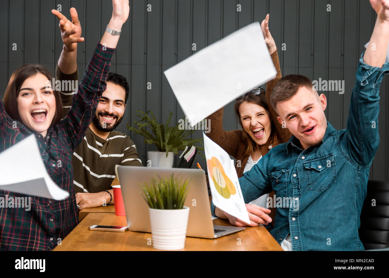 Thrilling reaction of it team to great success, four young workers ...
