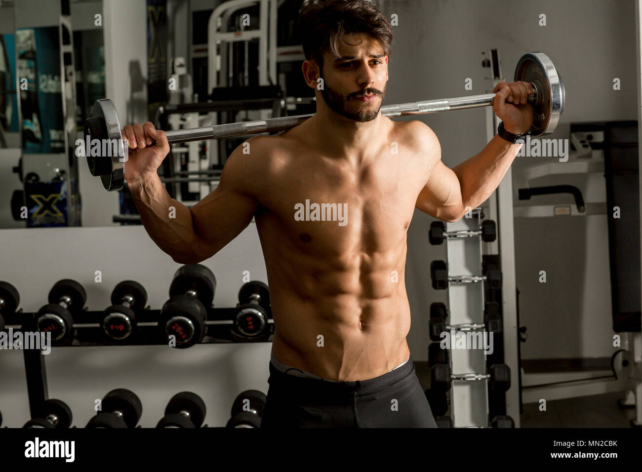 Portrait handsome bodybuilder doing exercise hi-res stock photography ...