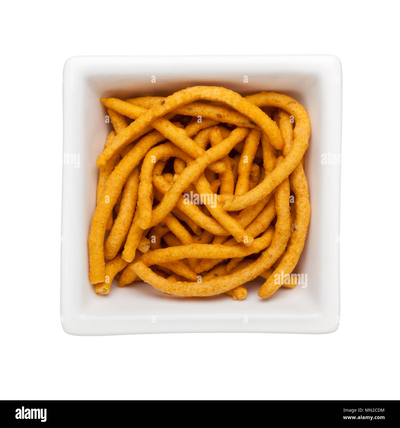 Pieces of muruku in a square bowl isolated on white background Stock ...