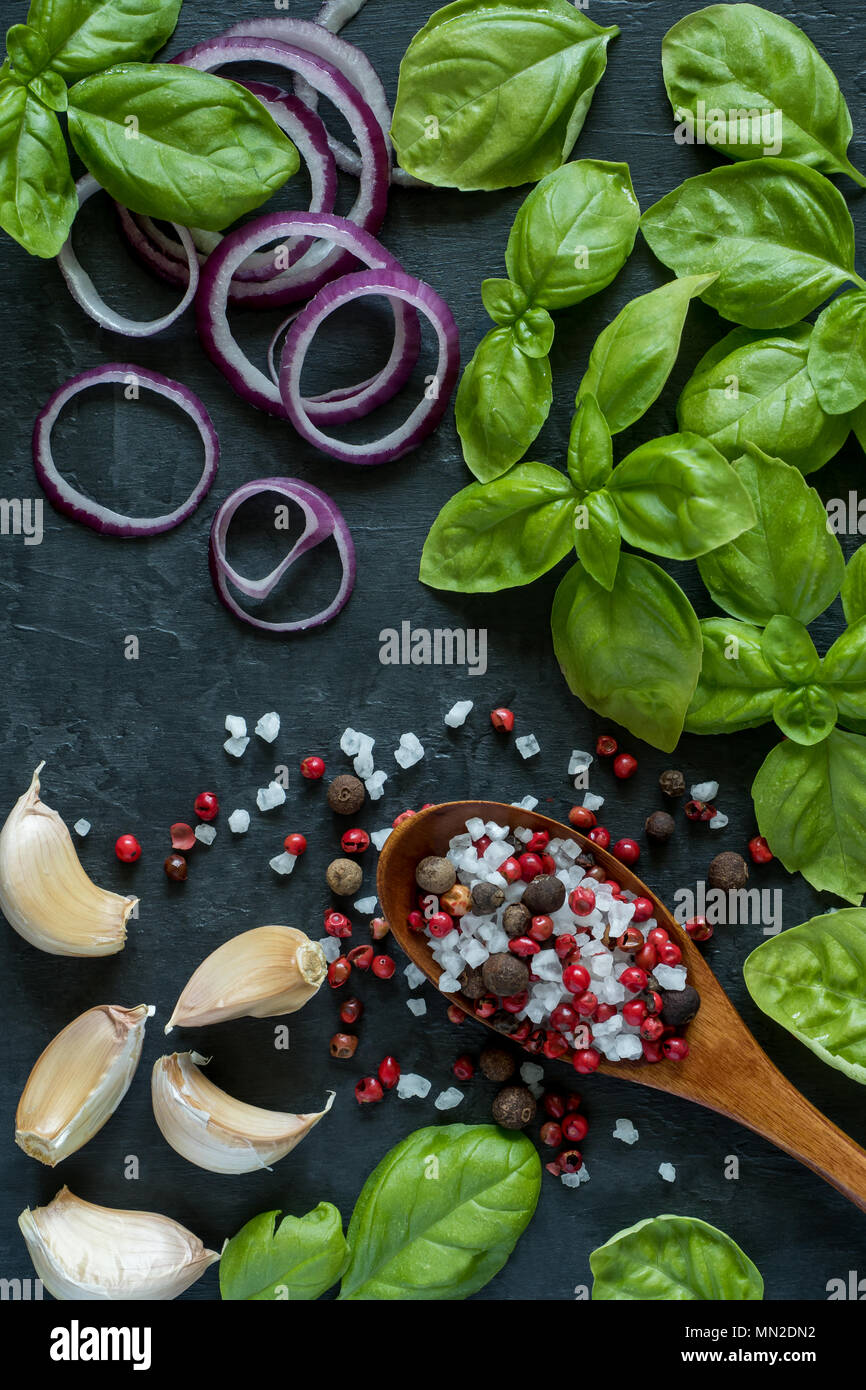 Basil Garlic and spices on stone table. The concept of cooking. Top ...