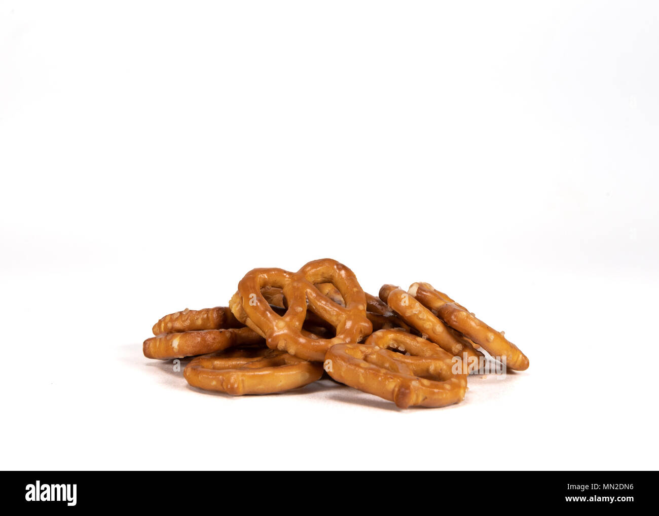 Small Pile of Pretzels on White Background Stock Photo - Alamy