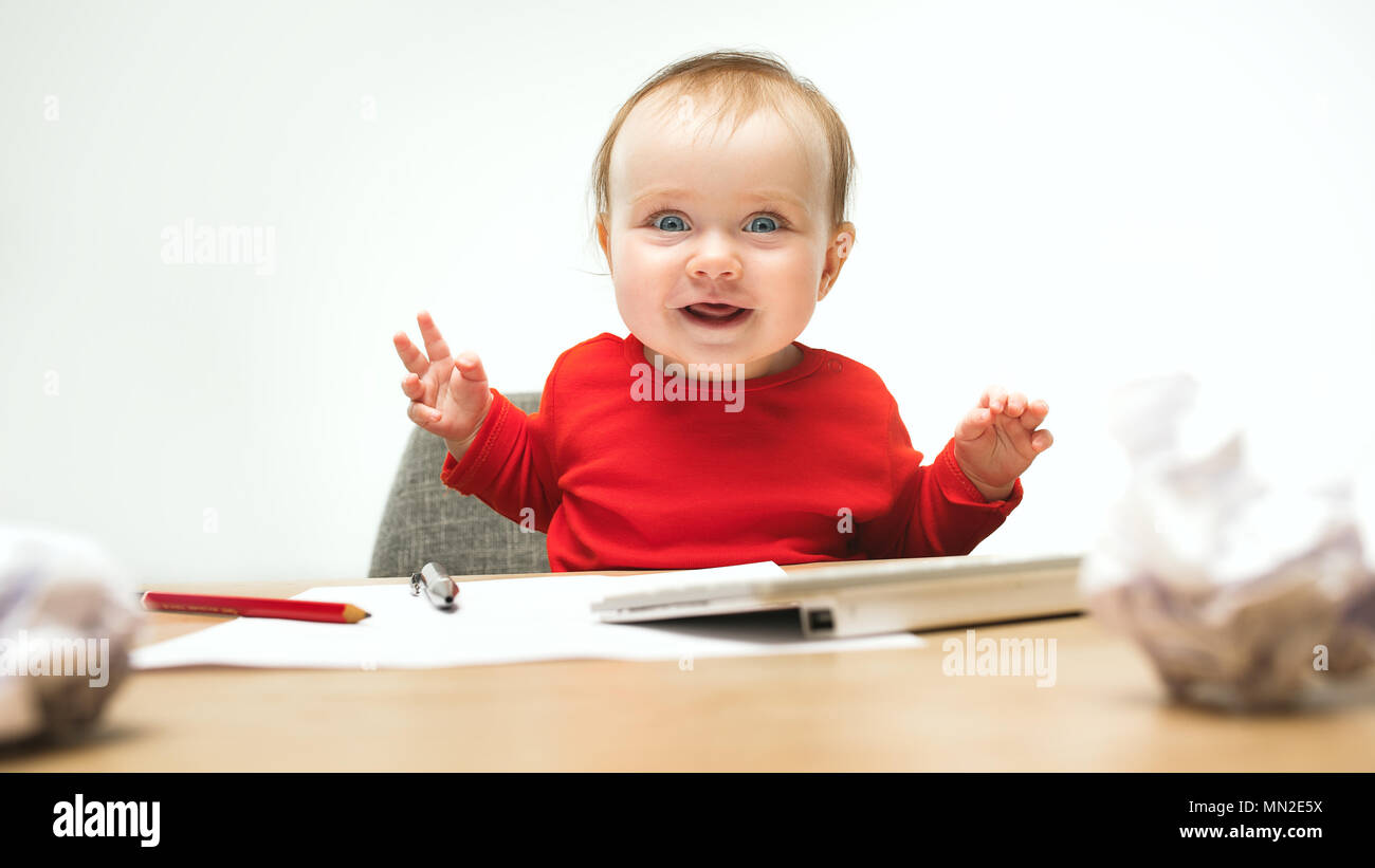 Happy child baby girl toddler sitting with keyboard of computer ...