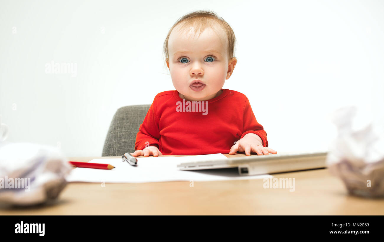 Happy child baby girl toddler sitting with keyboard of computer ...
