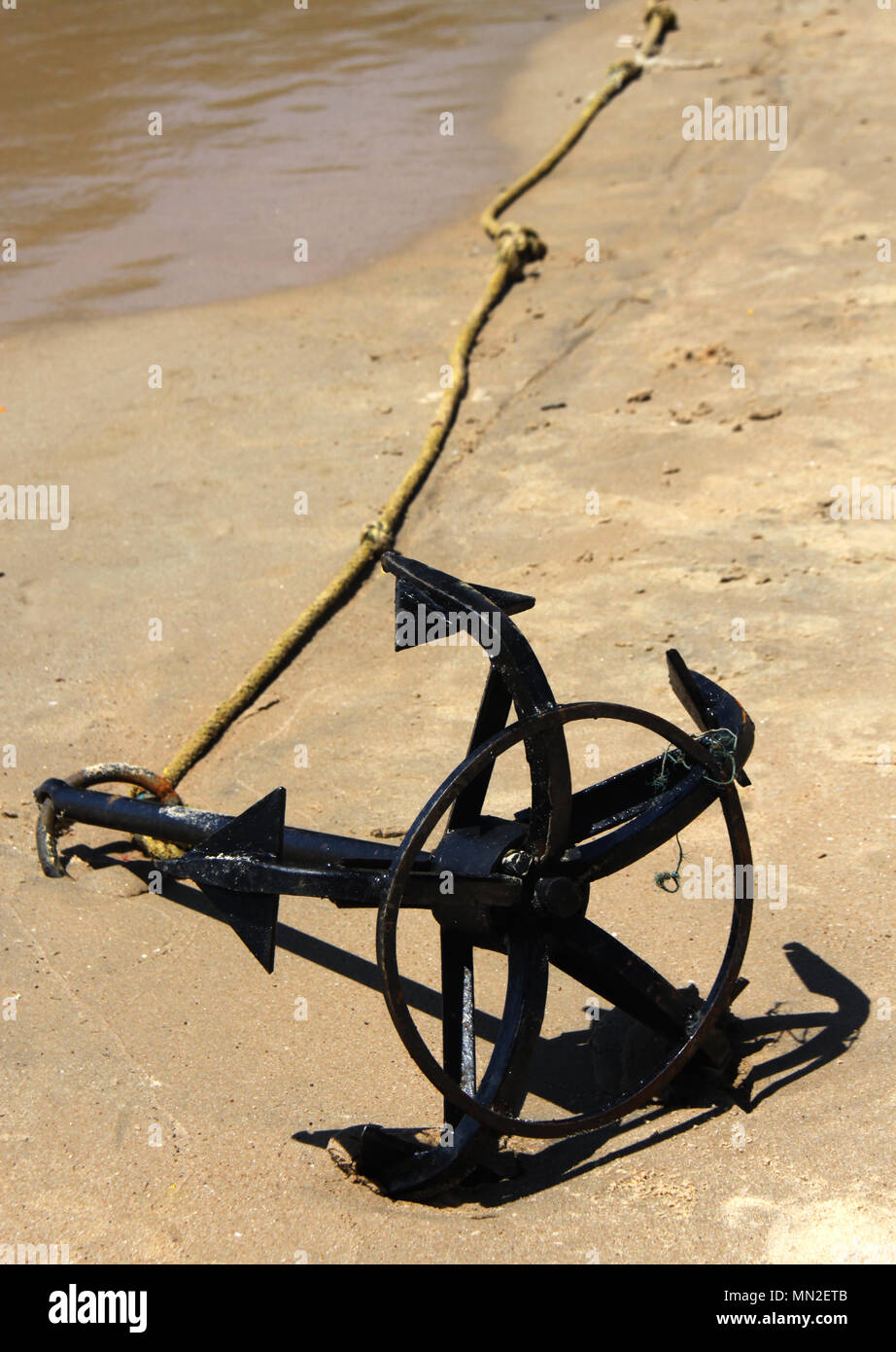 Anchor on seashore Stock Photo - Alamy