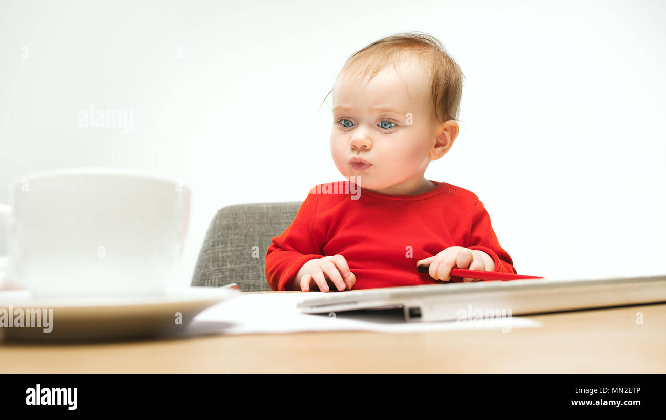 Happy child baby girl toddler sitting with keyboard of computer ...