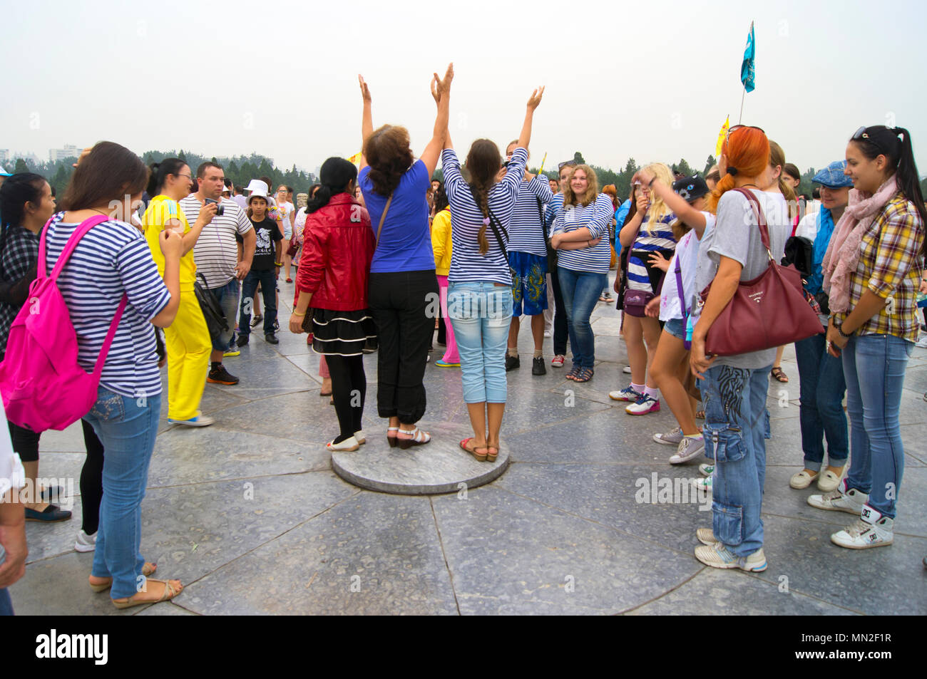 Visitors stand at the centre of the Circular Mound Altar at the ...