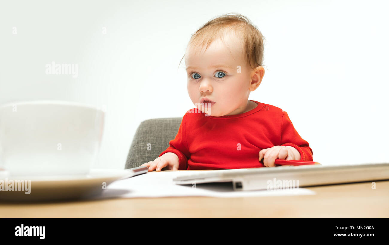 Happy child baby girl toddler sitting with keyboard of computer ...