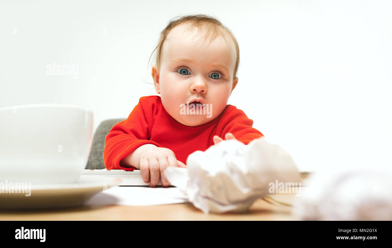 Happy child baby girl toddler sitting with keyboard of computer ...