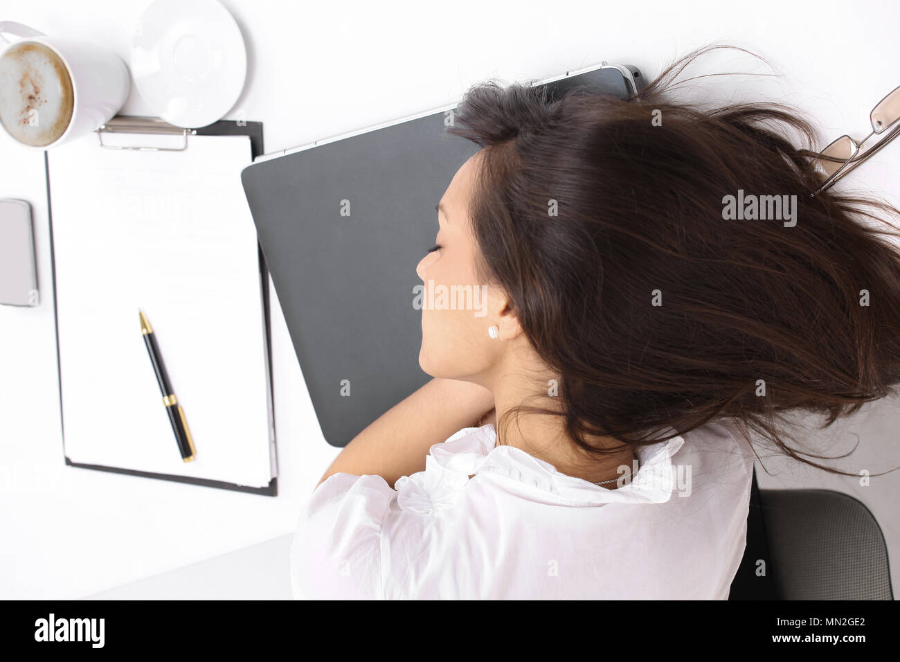 young businesswoman girl sleeping in her workplace Stock Photo - Alamy