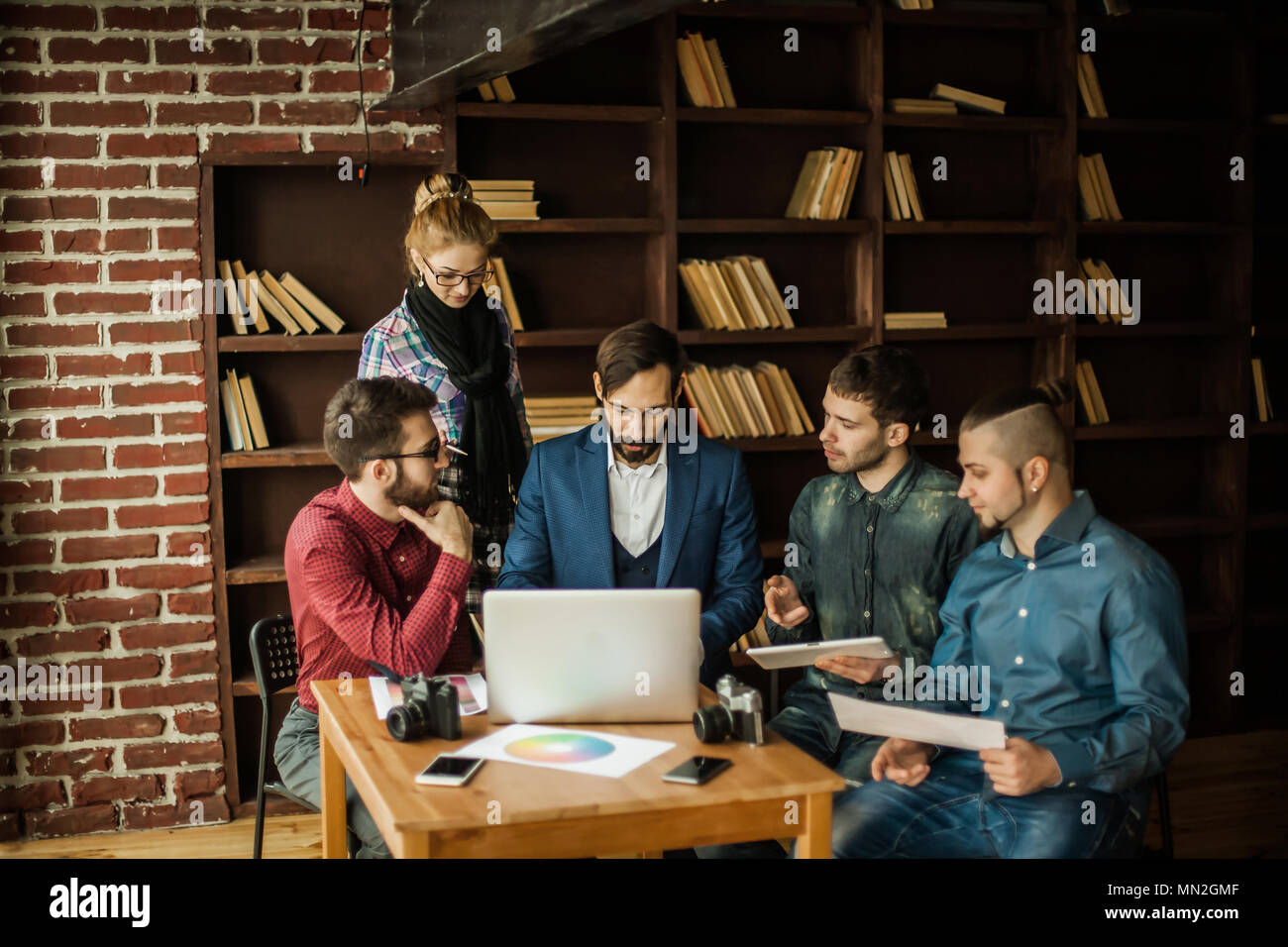 design team is discussing a new advertising project Stock Photo - Alamy