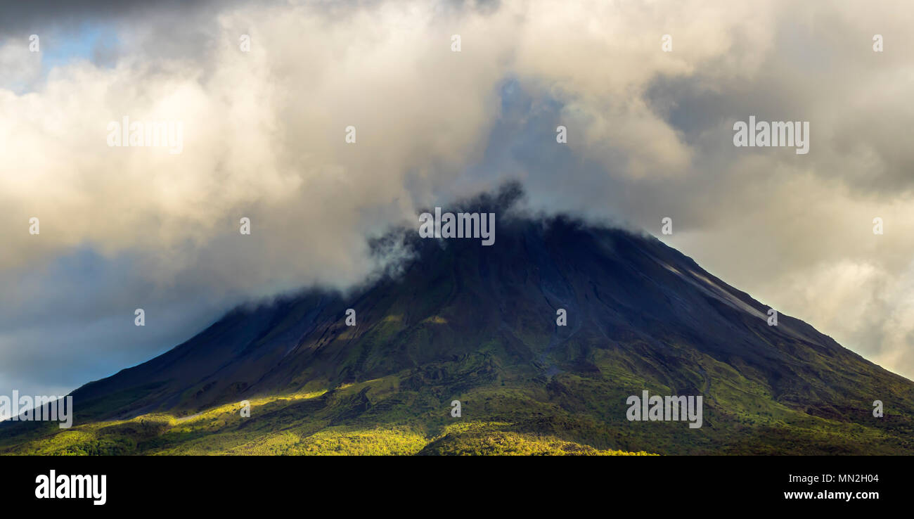 Cloud-topped Arenal Volcano National Park. Active volcano in Costa Rica ...