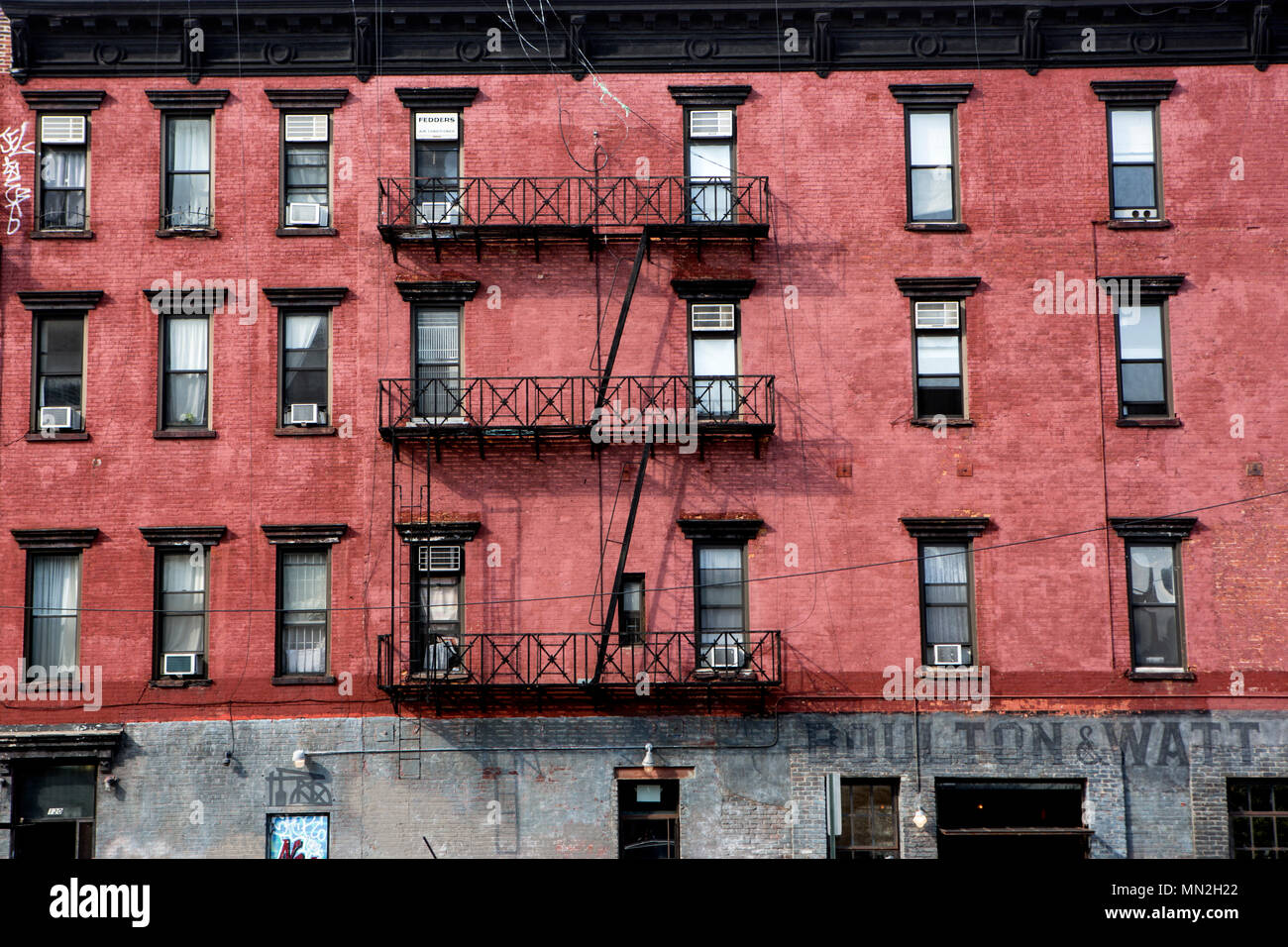 A red brick building with fire escapes in Manhattan, New York City ...