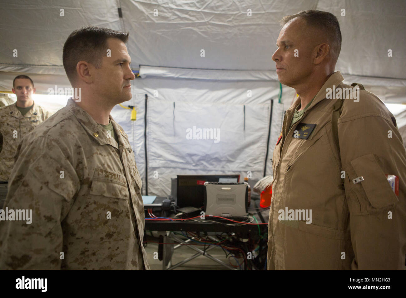U.S. Marine Corps Maj. Matthew Sproat, left, future operations officer ...